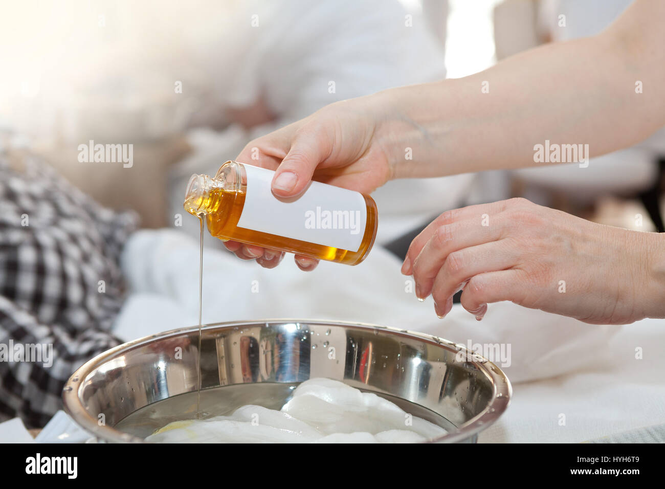 Hand treatment, oil bath before the massage therapy Stock Photo - Alamy