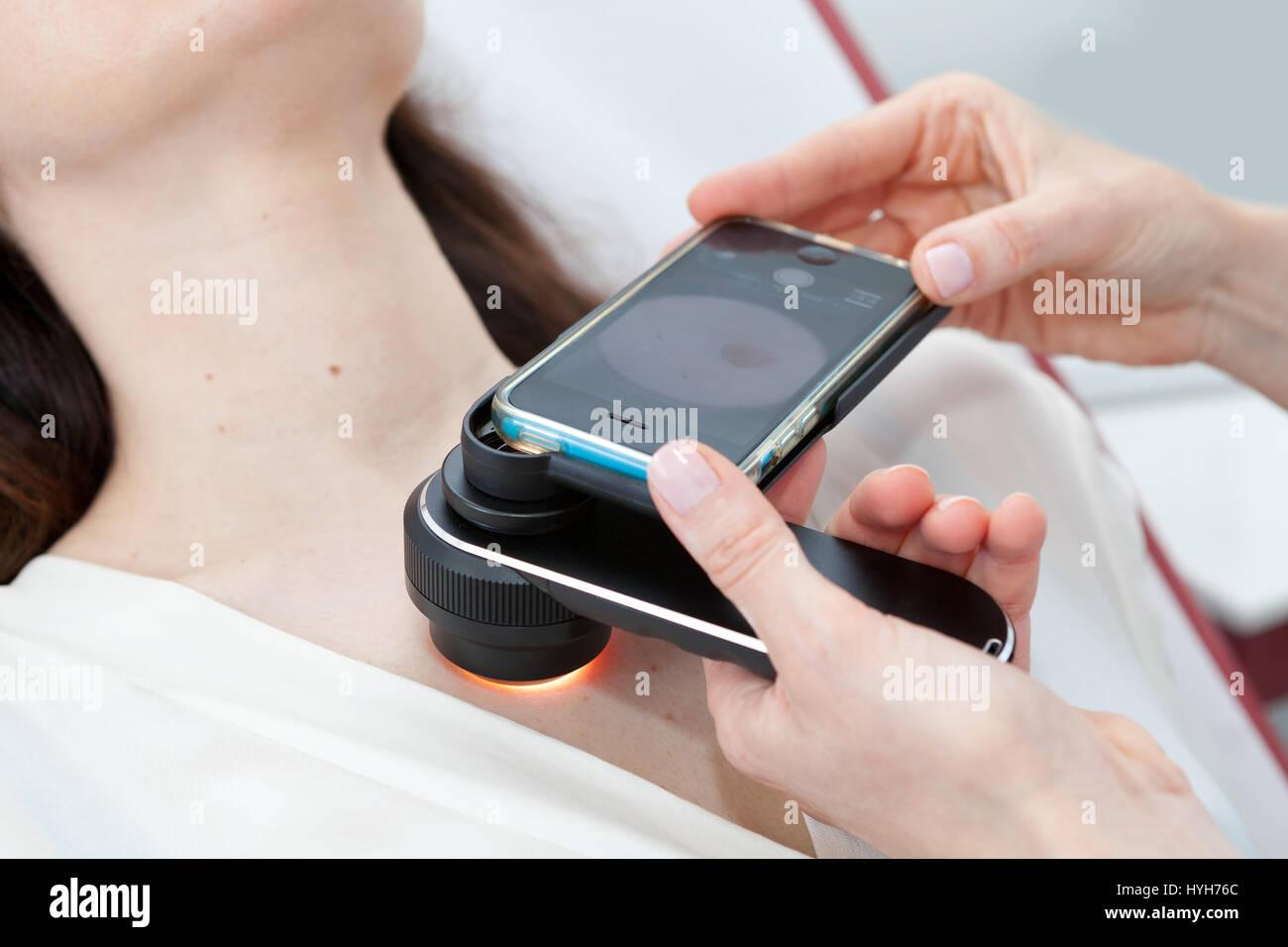 Dermatologist Examining Birthmarks And Moles On A Female Patient