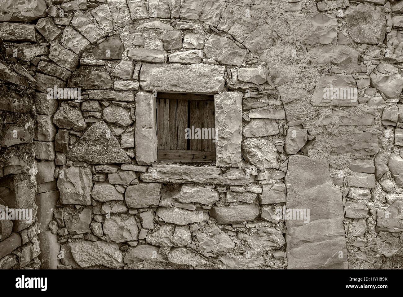 stone window positioned in walled portal Stock Photo - Alamy