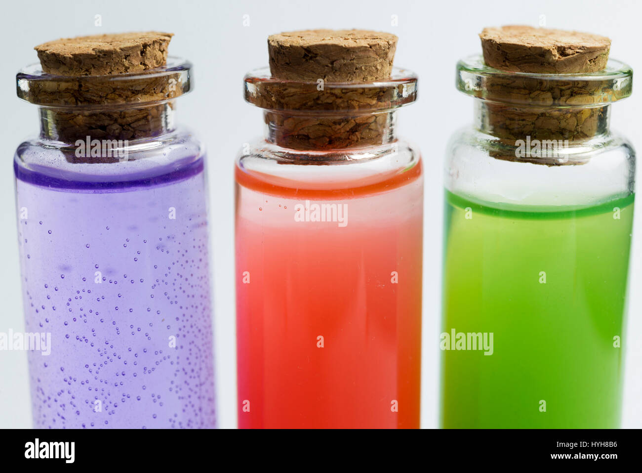 three flasks for laboratory measurement of liquids on a white ...