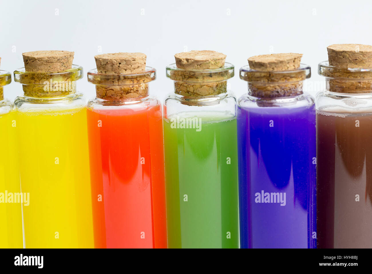 Colored liquids in five test tubes isolated over white background Stock ...