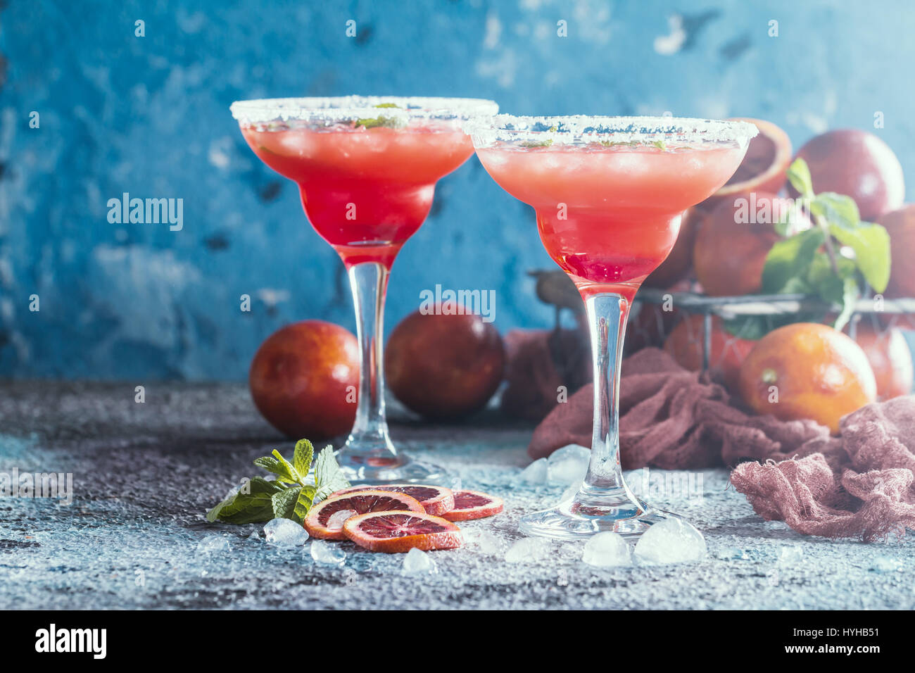 Blood Orange Margarita cocktail with mint and red orange in salt rimmed ...