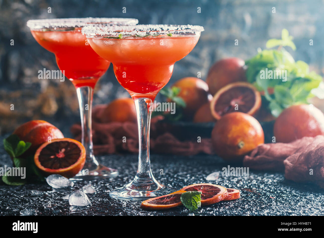 Blood Orange Margarita cocktail with mint and red orange in salt rimmed ...