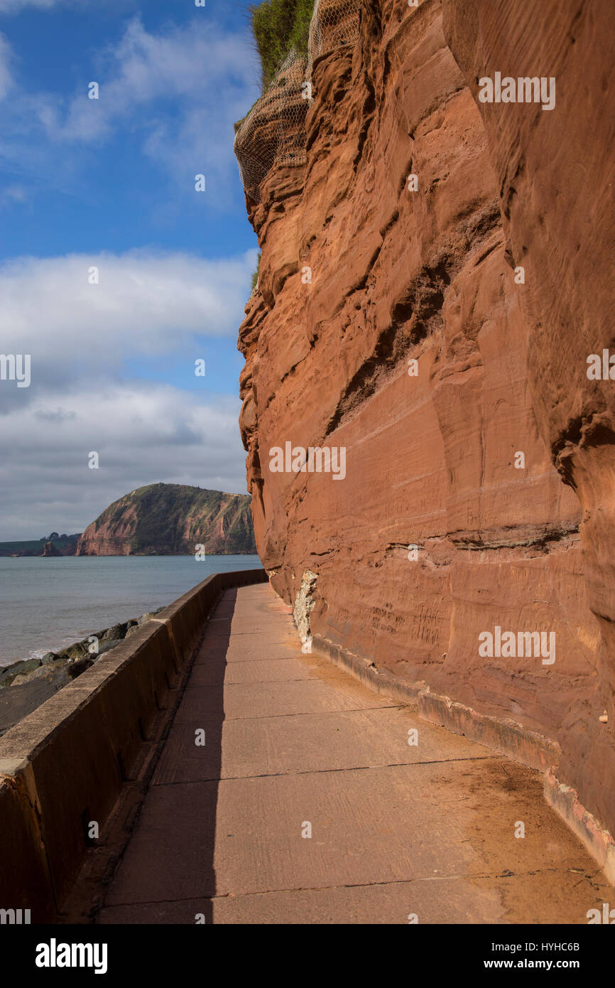 The Clifton Walkway beneath the red sandstone cliffs at Sidmouth,Devon ...