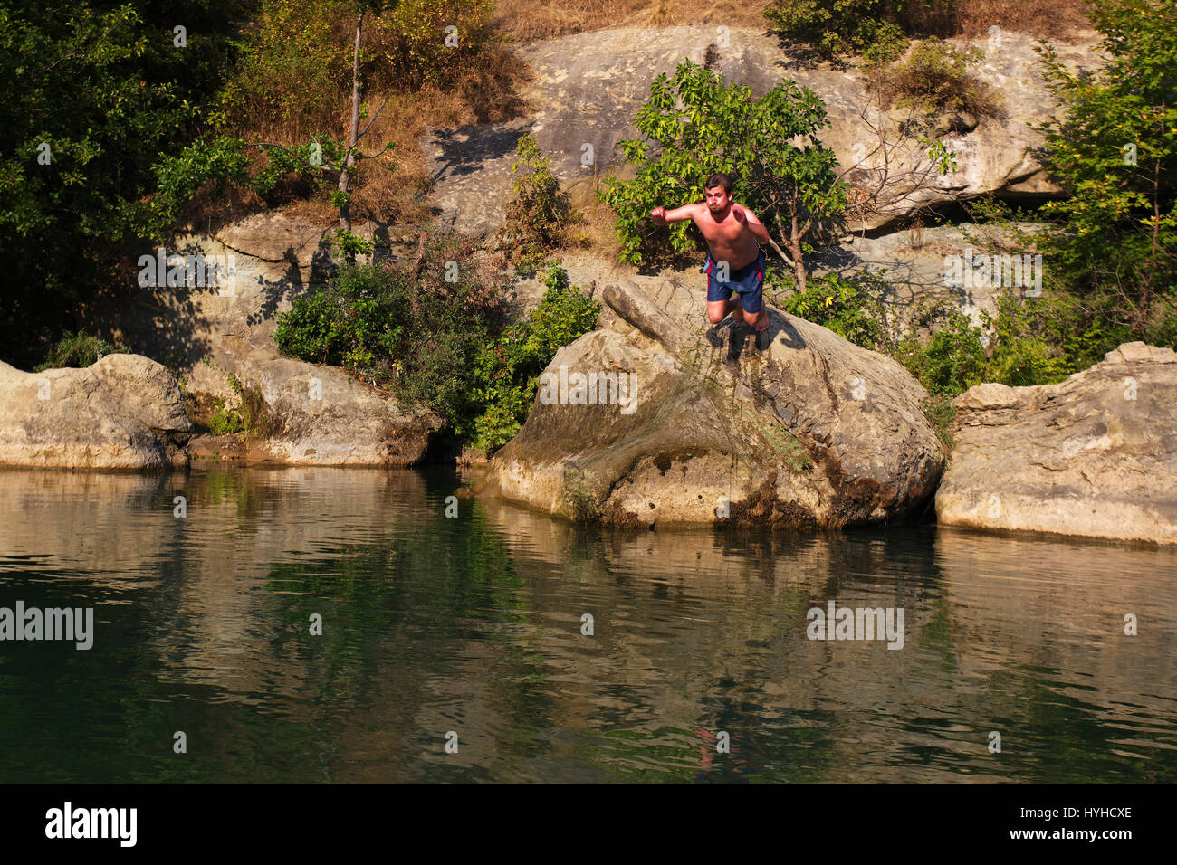 Jumping to the river in Albania Stock Photo - Alamy