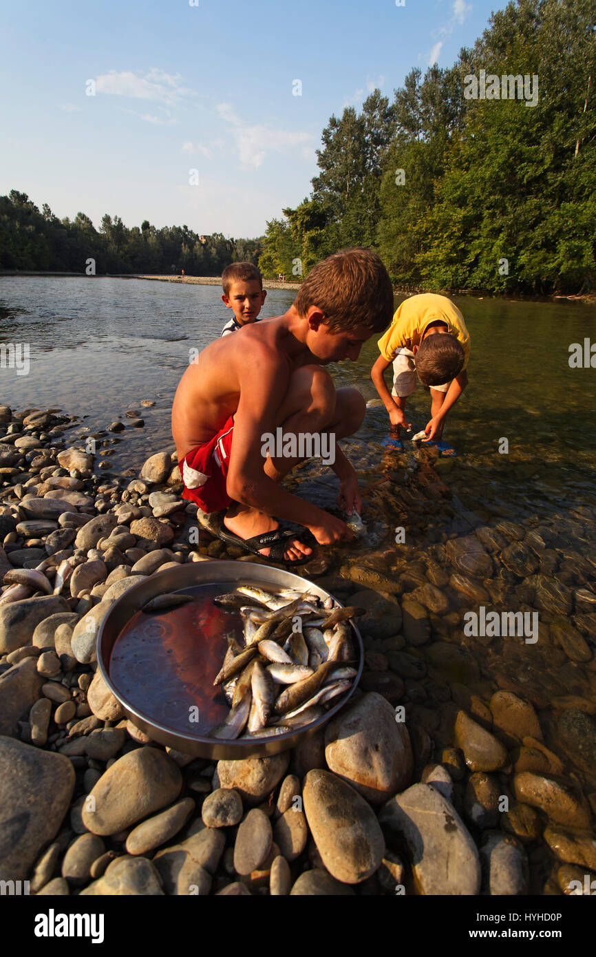 Kids catching fish on the Mati River,Albania Stock Photo - Alamy