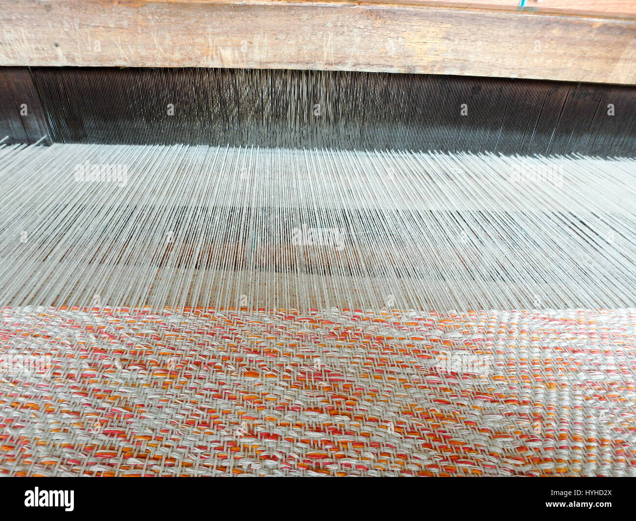 Close up of yarn on vintage wood weaving loom Stock Photo - Alamy