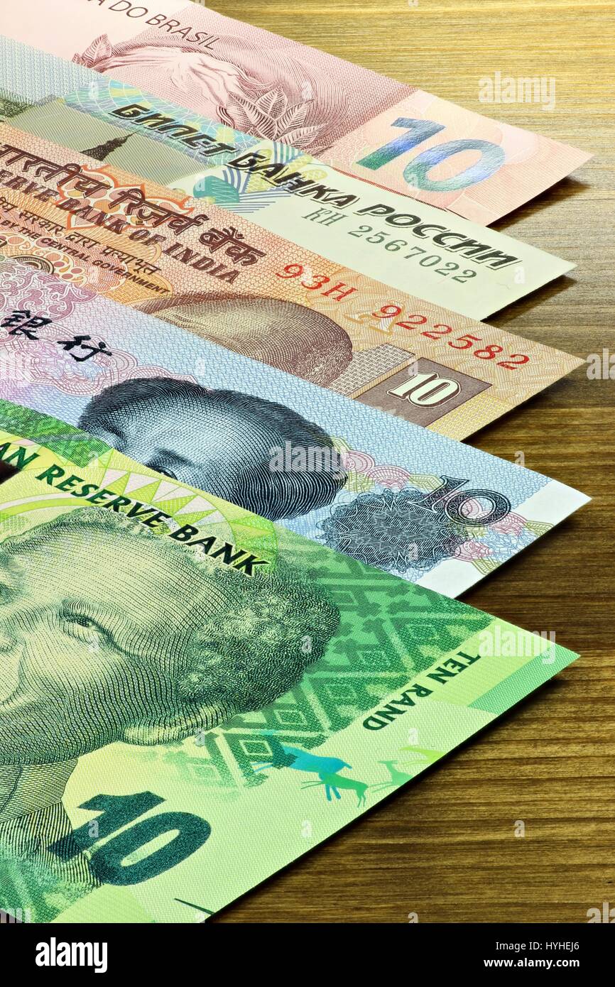 banknotes of the BRICS states on wooden background Stock Photo - Alamy