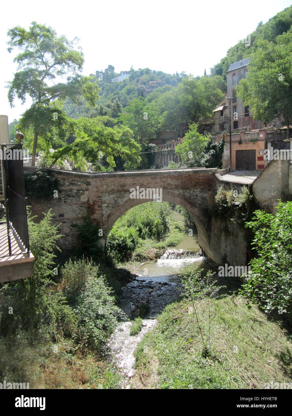 Granada. River Darro ,with an ancient stone arched footbridge Albaicin ...