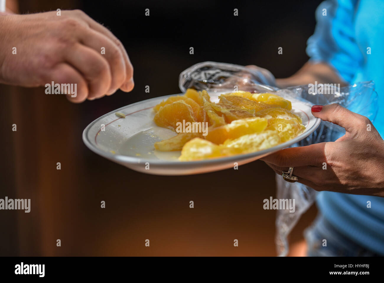 Hand sharing food from plate hi-res stock photography and images - Alamy