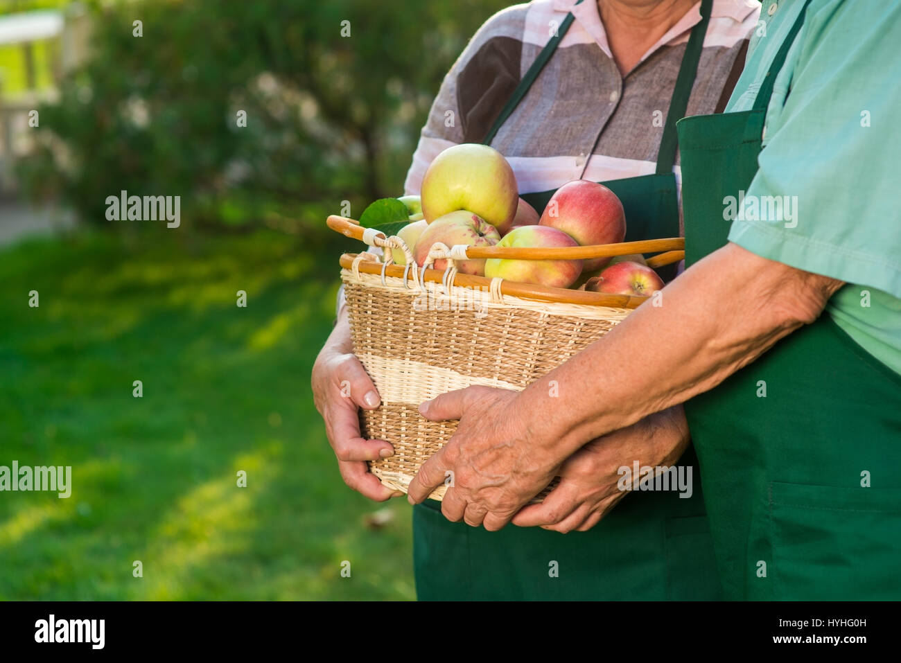 Old woman holding an apple hi-res stock photography and images - Alamy