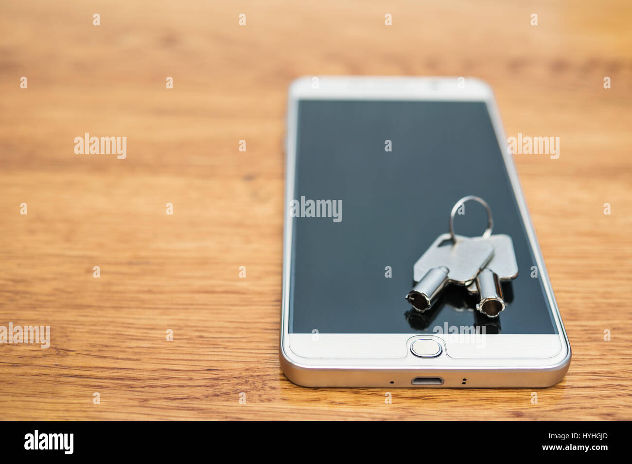 Keys are on the mobile phone Stock Photo - Alamy