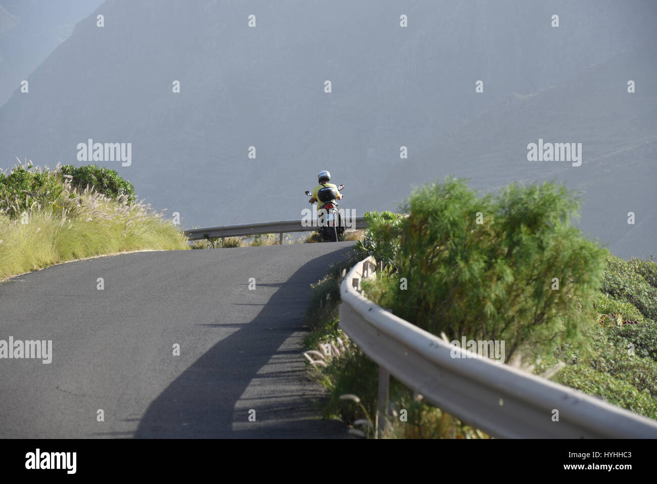 Scooter driving on mountain roads Stock Photo - Alamy