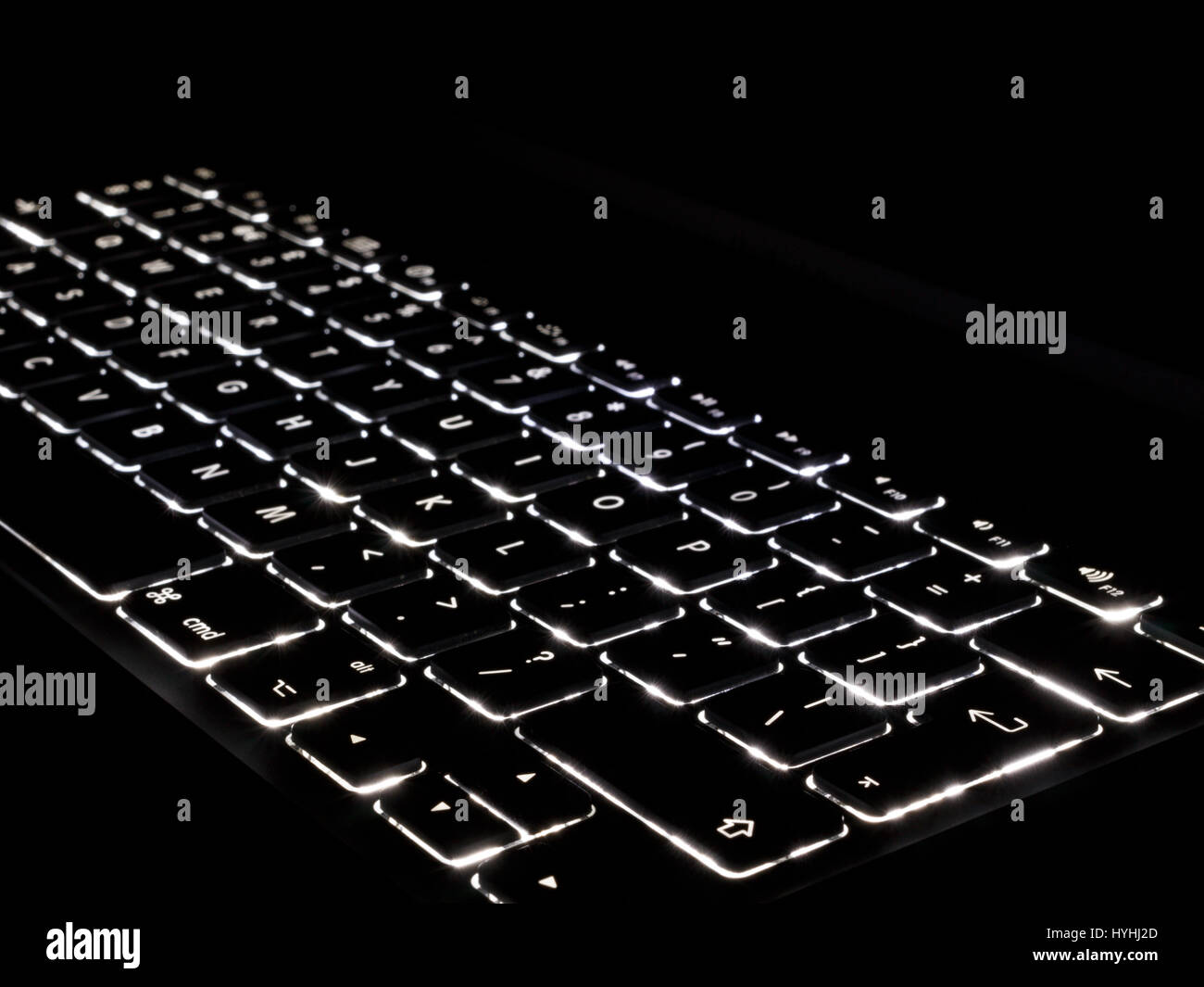 An illuminated keyboard on a black background Stock Photo - Alamy