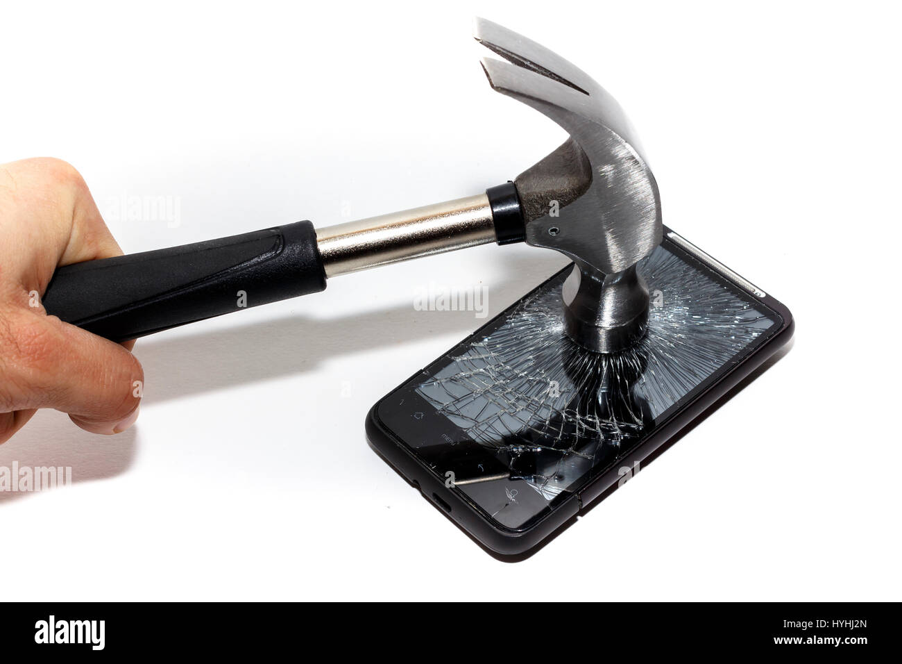 A hammer striking a phone, shattering its screen Stock Photo - Alamy