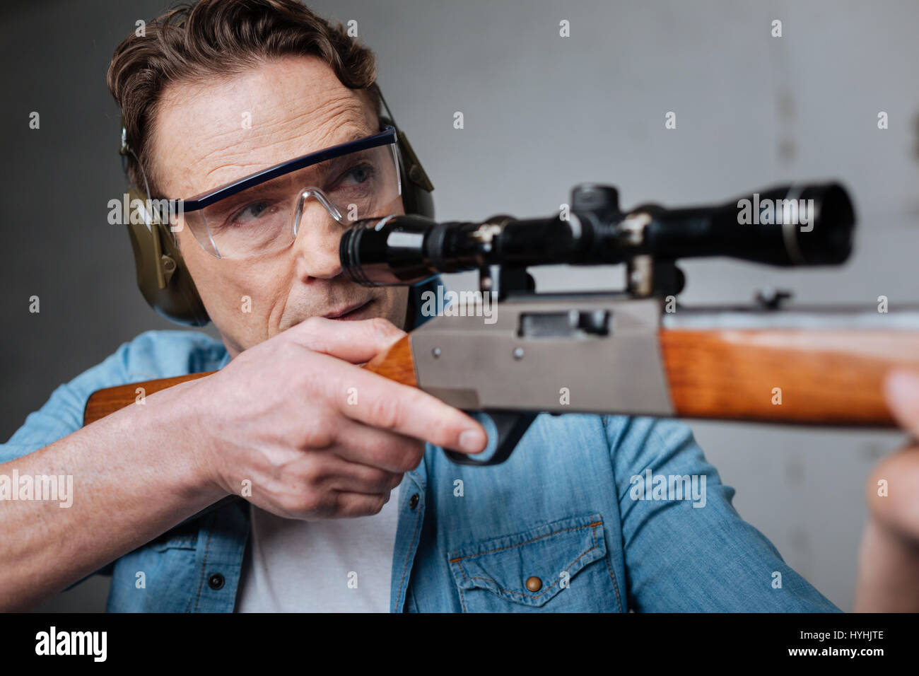 Skilled professional marksman having target practice Stock Photo - Alamy
