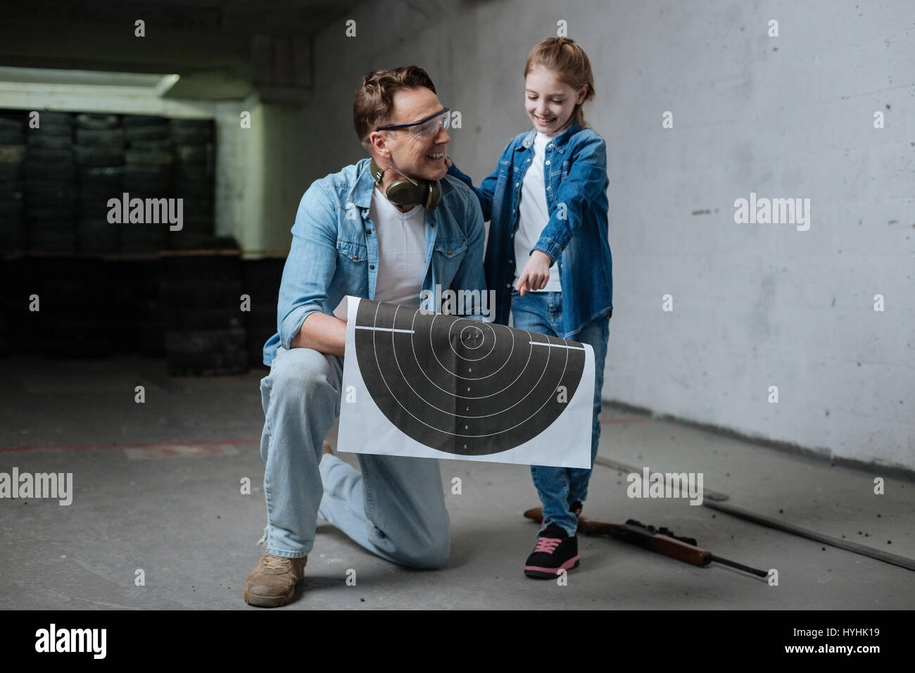Happy delighted man holding the target Stock Photo - Alamy