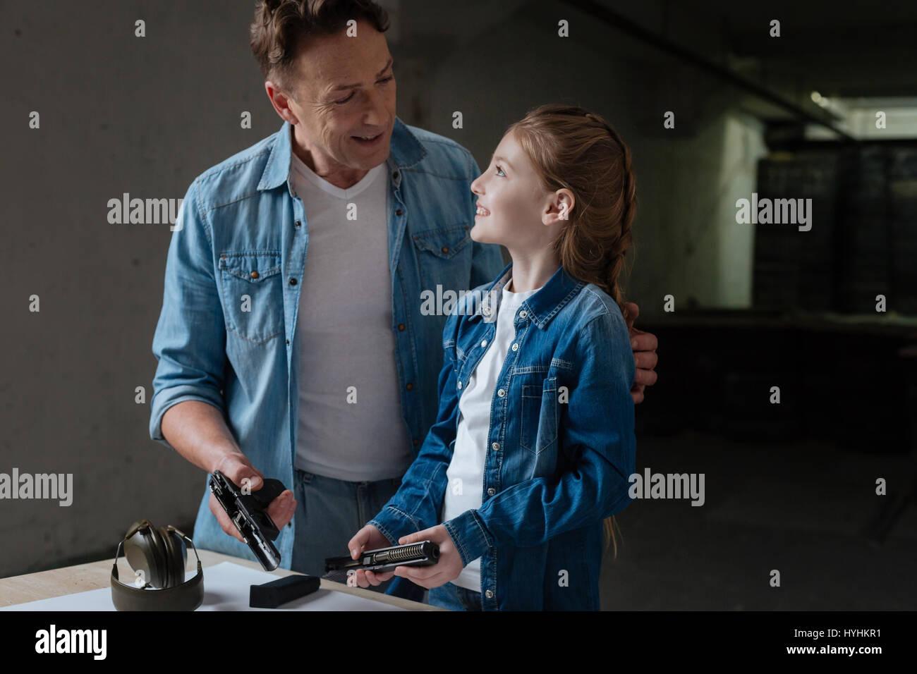 Cheerful positive father looking at his daughter Stock Photo - Alamy