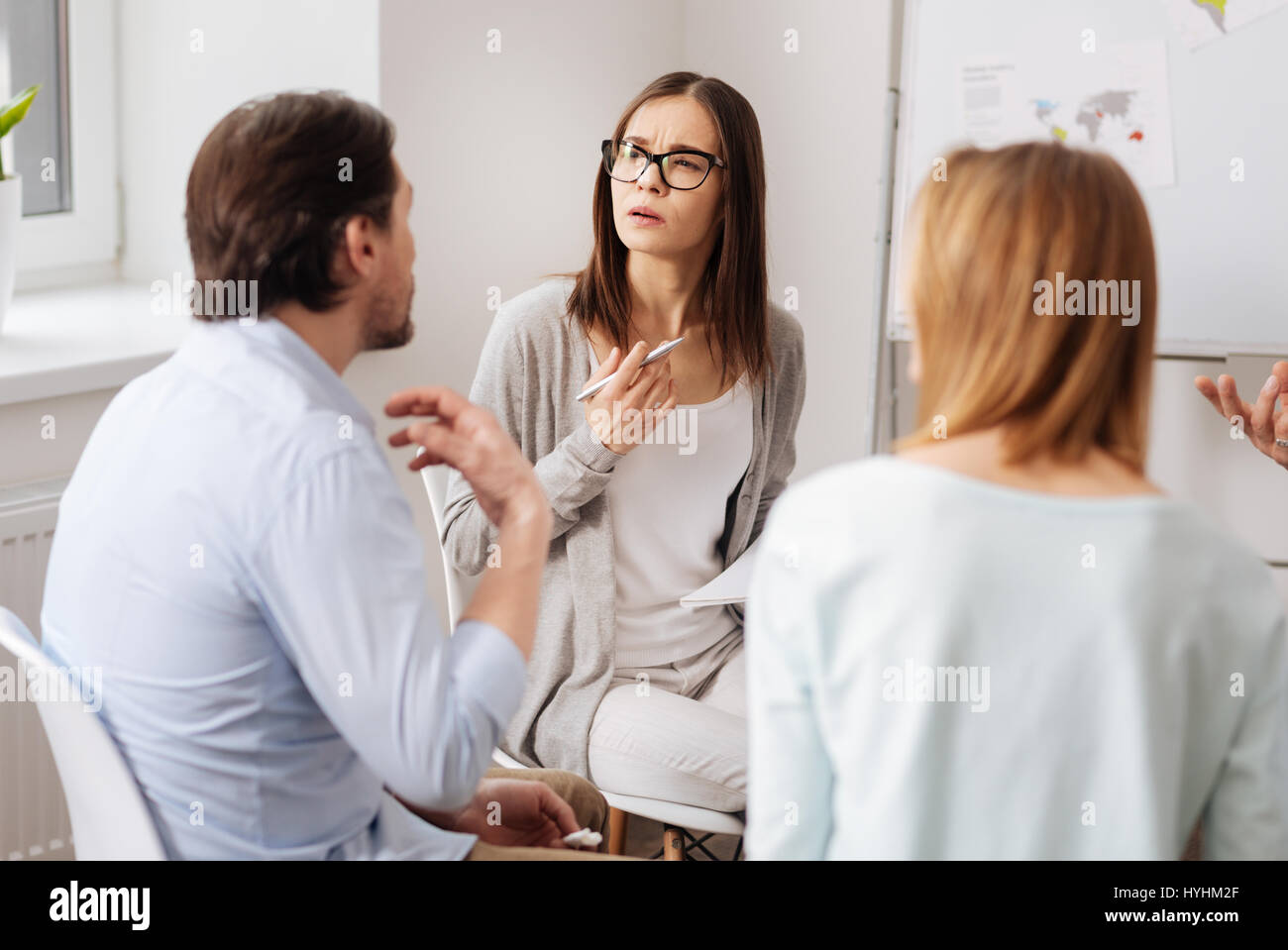 Office workers debating at meeting Stock Photo - Alamy