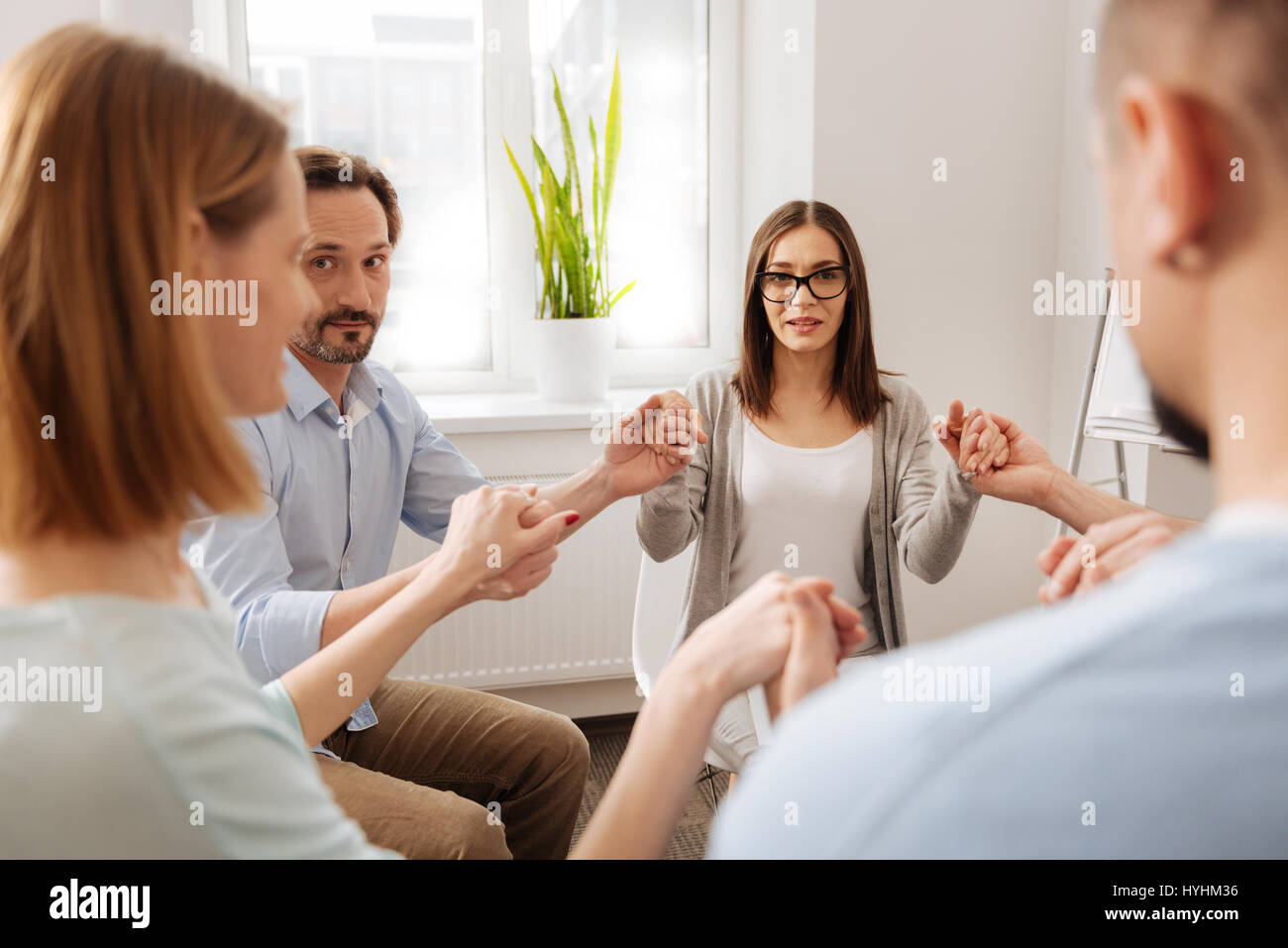 Delighted male person looking out his coworker Stock Photo - Alamy