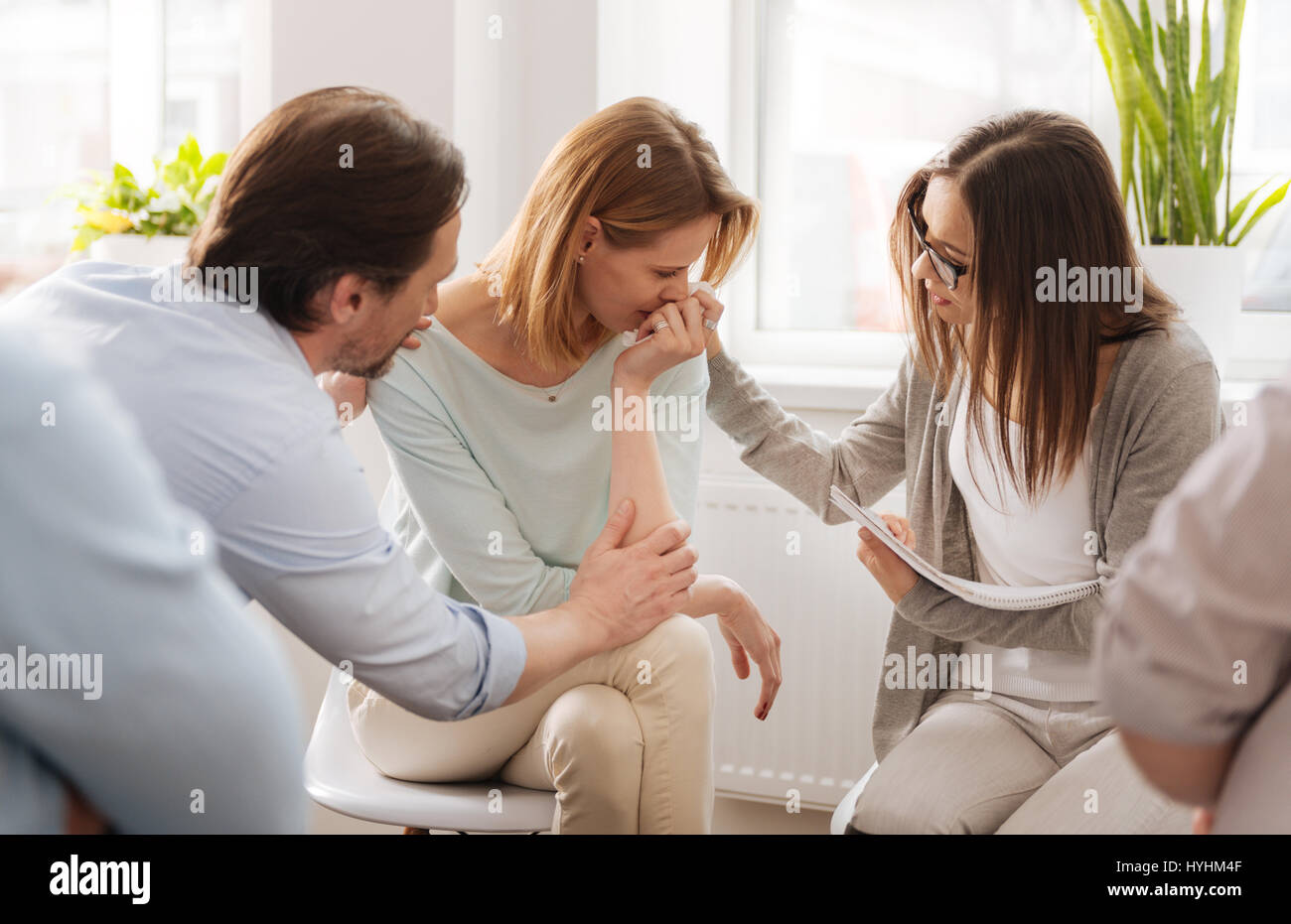 All colleagues soothing their friend Stock Photo - Alamy