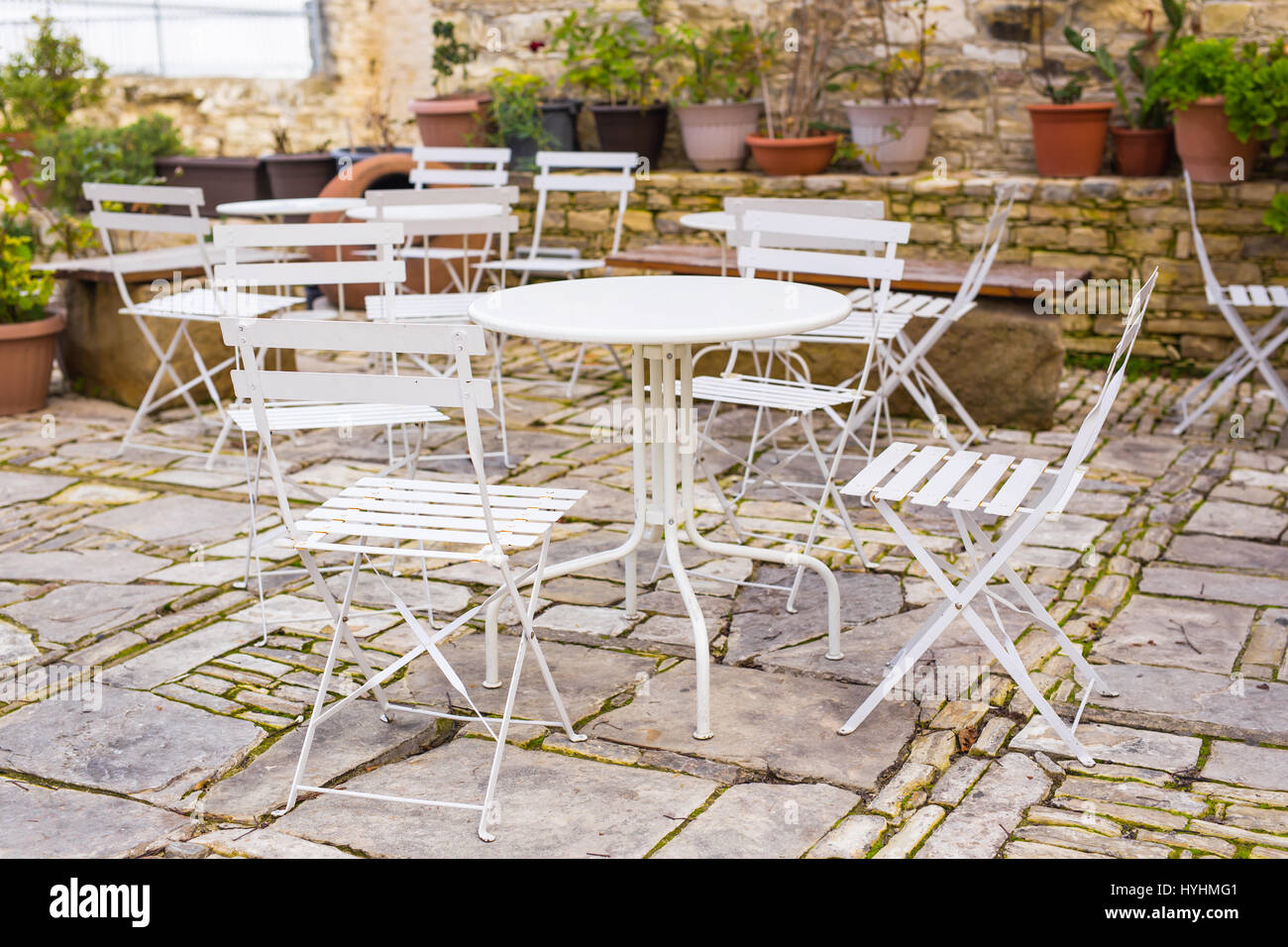 old-fashioned Cafe terrace with tables and chairs Stock Photo - Alamy