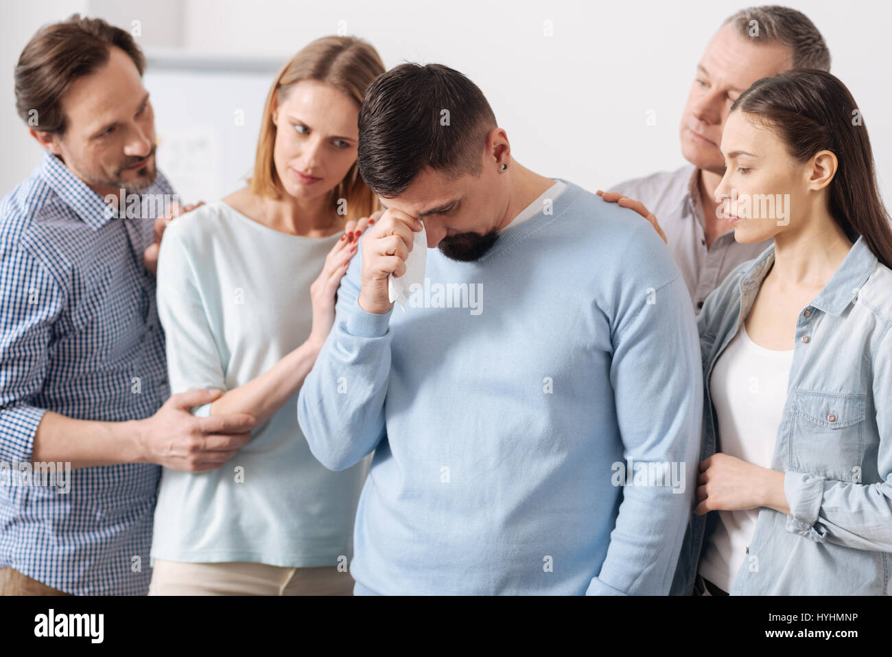 Photo of sad man that touching his forehead Stock Photo - Alamy