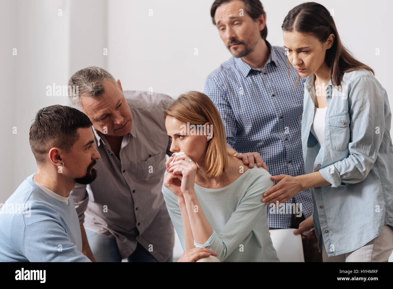 Company of workers cheering up their colleague Stock Photo - Alamy