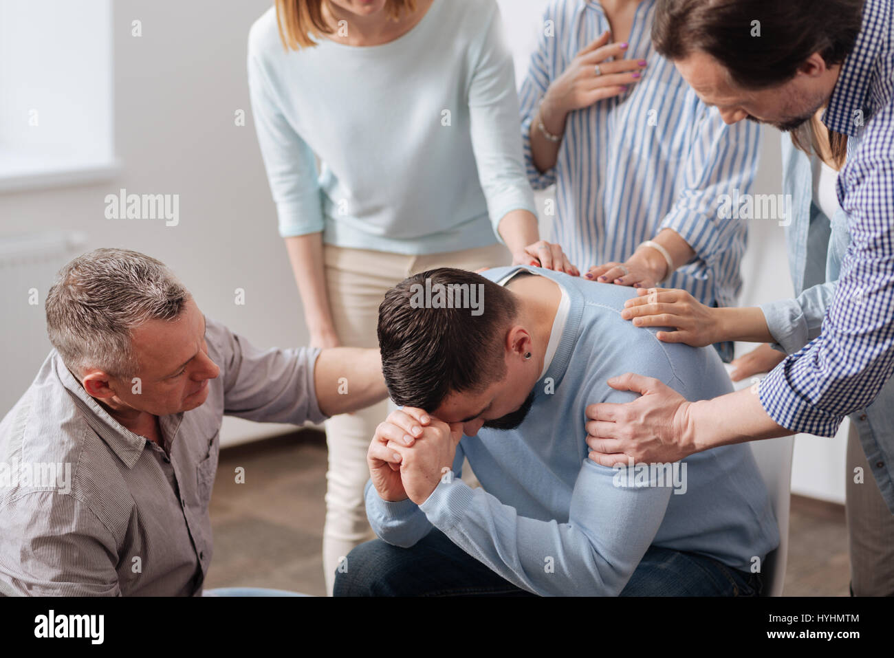 Man stooping hi-res stock photography and images - Alamy