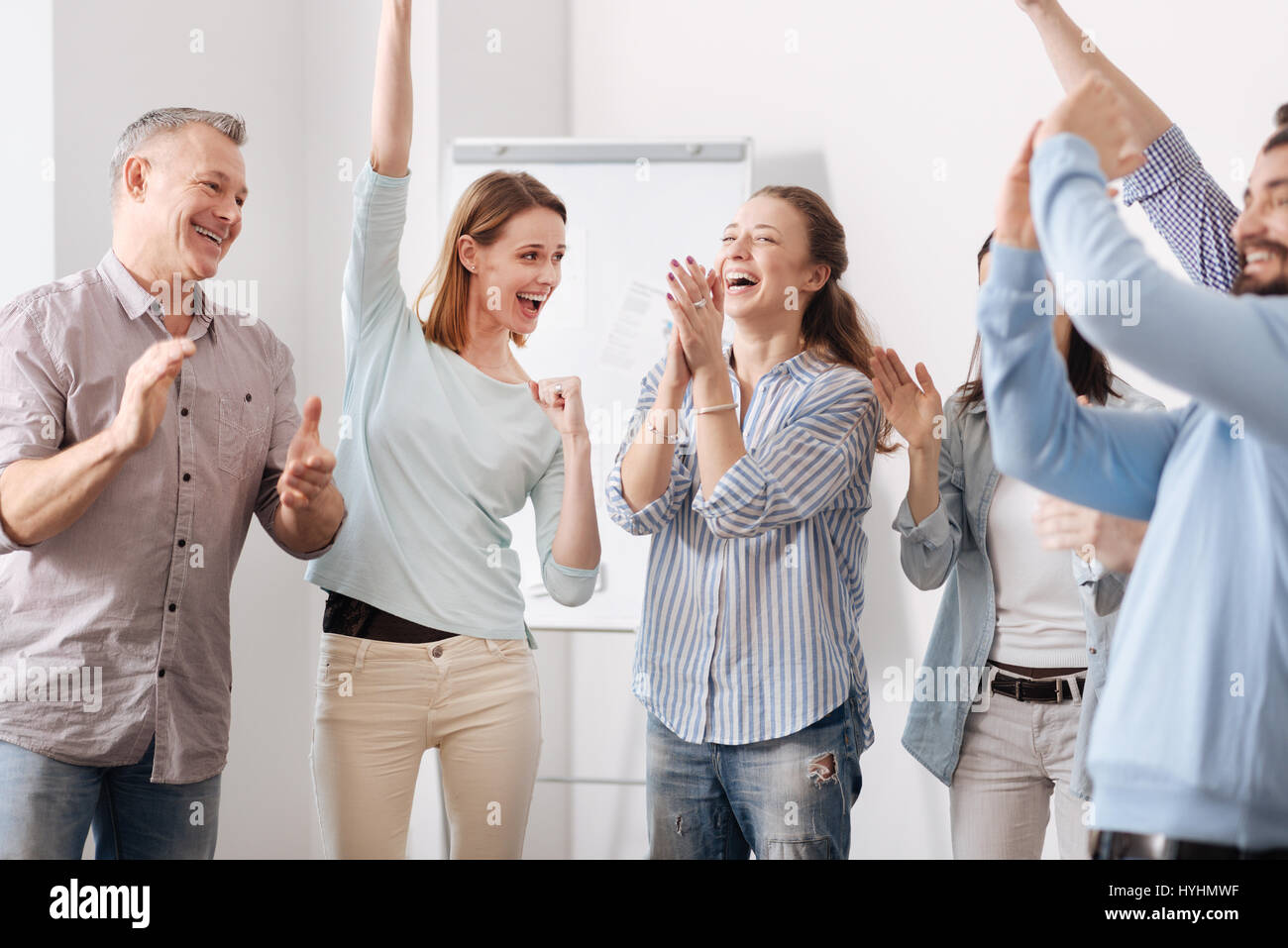Happy coworkers being very glad Stock Photo - Alamy
