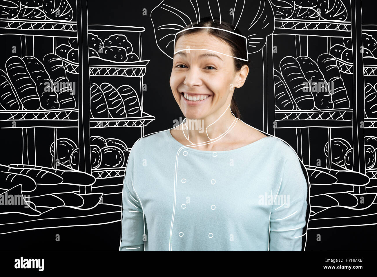 Positive baker being involved in work Stock Photo - Alamy