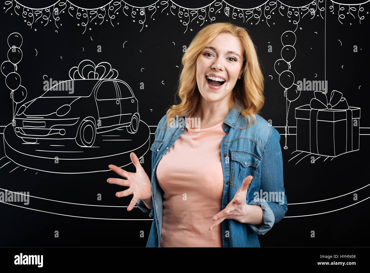 Cheerful woman winning the car Stock Photo - Alamy