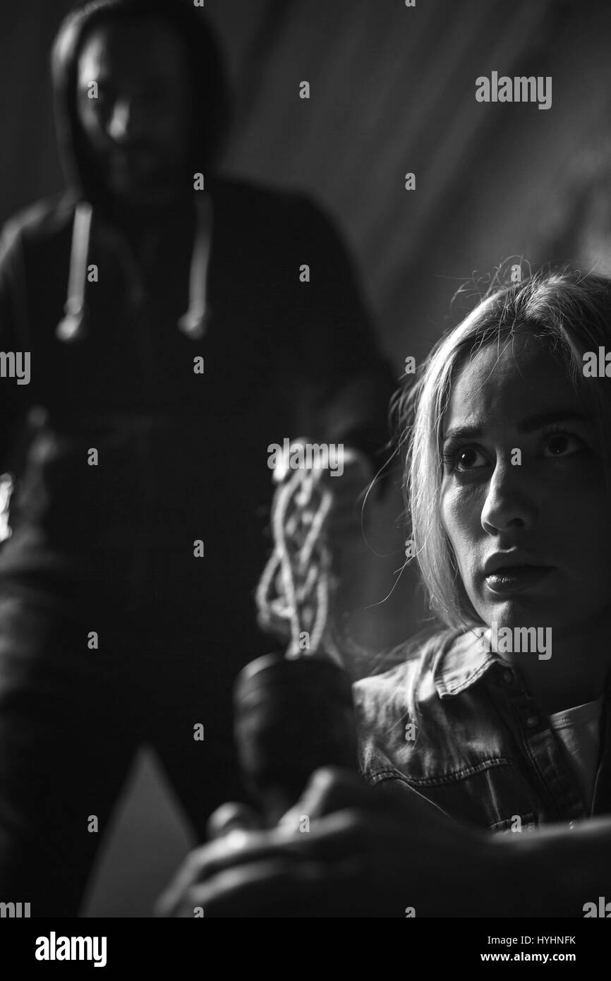 Scared blonde girl feeling something being wrong Stock Photo - Alamy