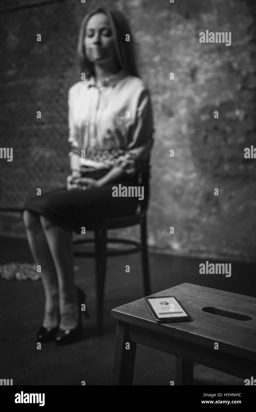 Frightened tied woman hoping for a rescue Stock Photo - Alamy