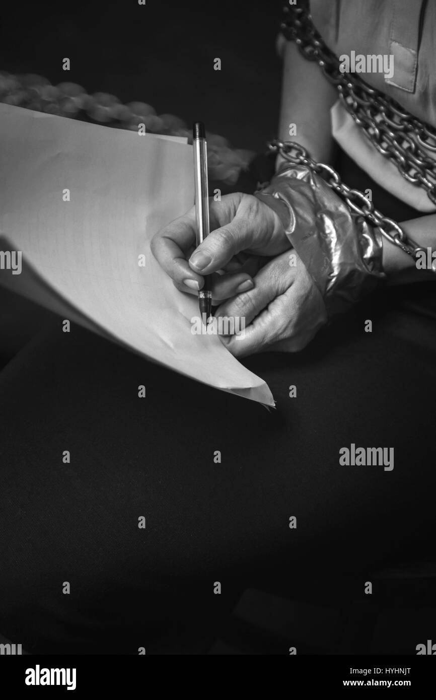 Dangerous kidnapper forcing his hostages signature Stock Photo - Alamy