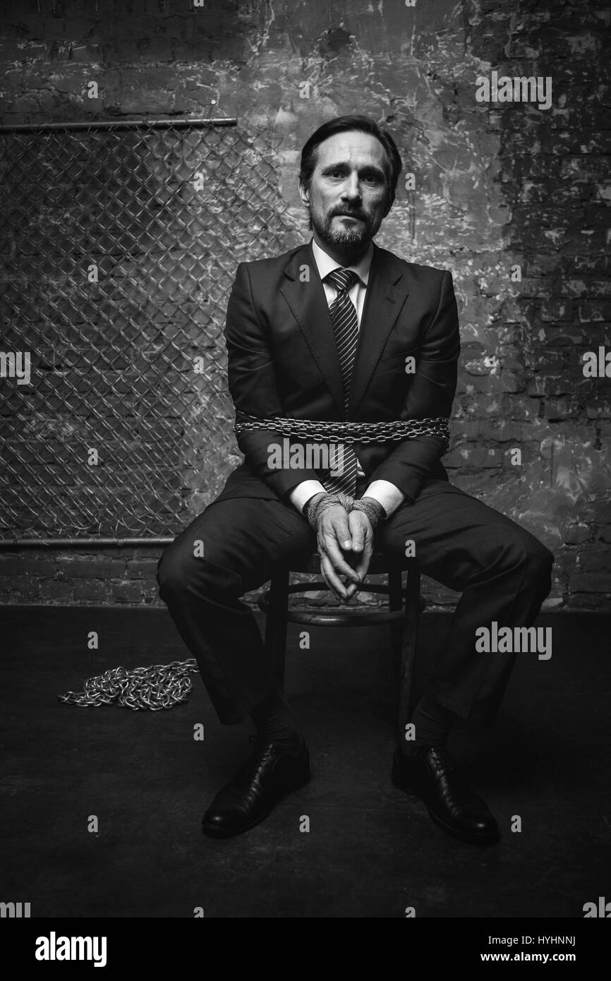 Anxious scared hostage being blackmailed Stock Photo - Alamy