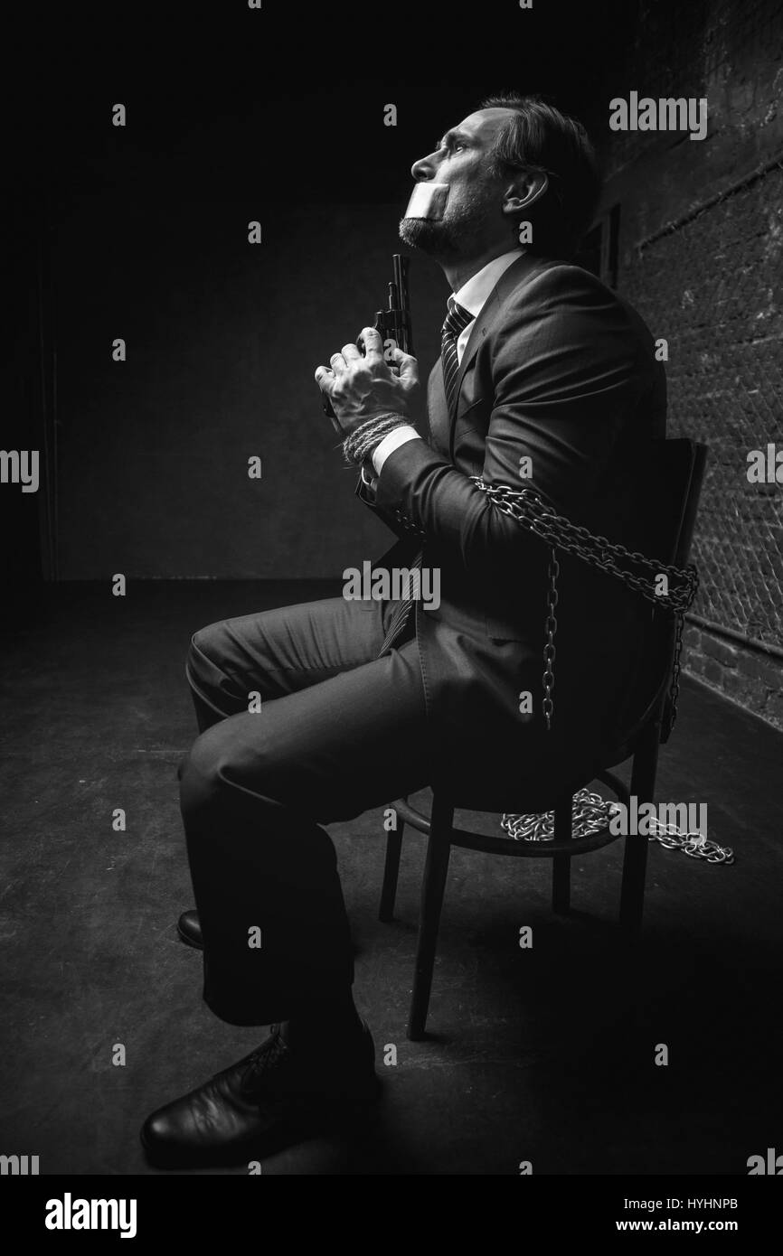 Reckless tortured man ready pulling a trigger Stock Photo - Alamy