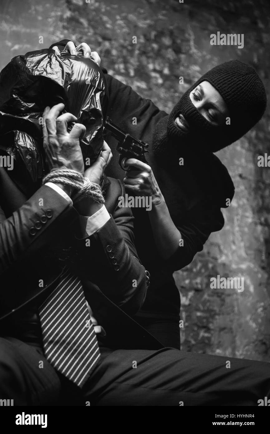 Abducted scared man not understanding what happening Stock Photo - Alamy