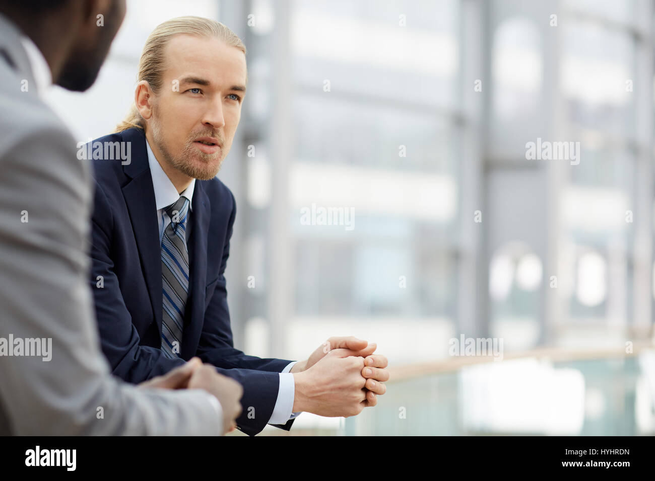 Talk of businessmen Stock Photo - Alamy