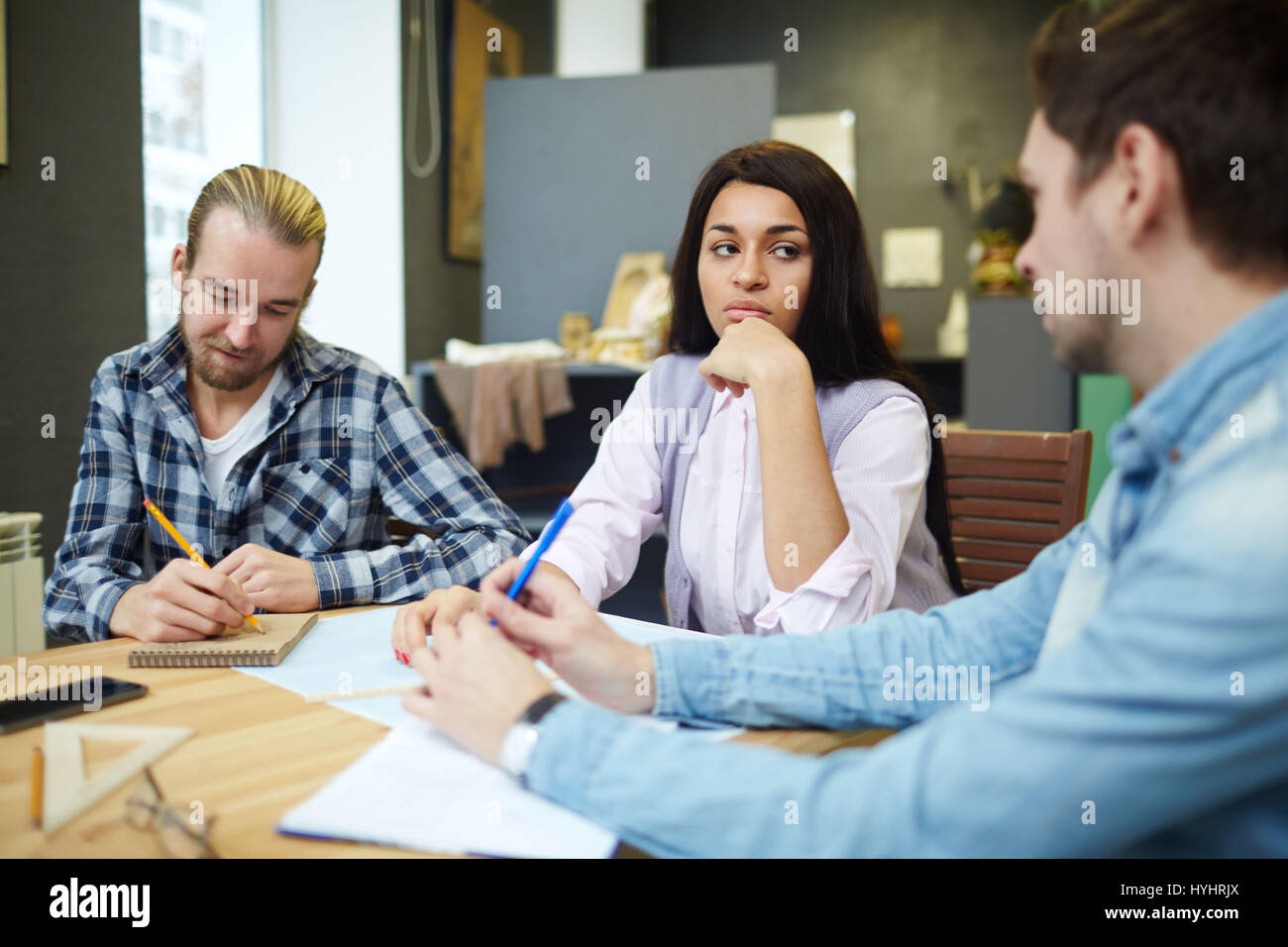 Listening to groupmate Stock Photo - Alamy