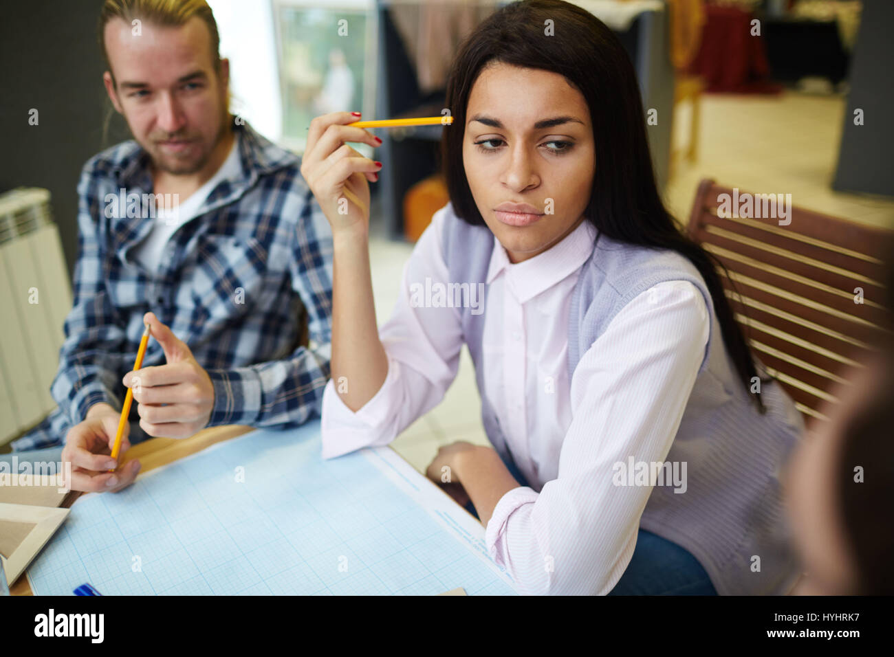 Listening to groupmate Stock Photo - Alamy