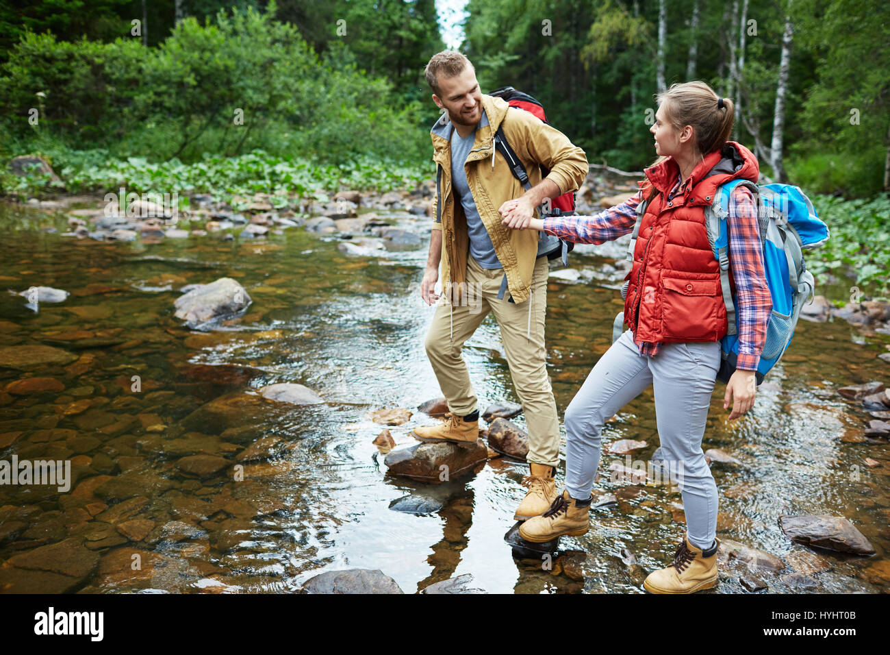 Walking through river Stock Photo - Alamy