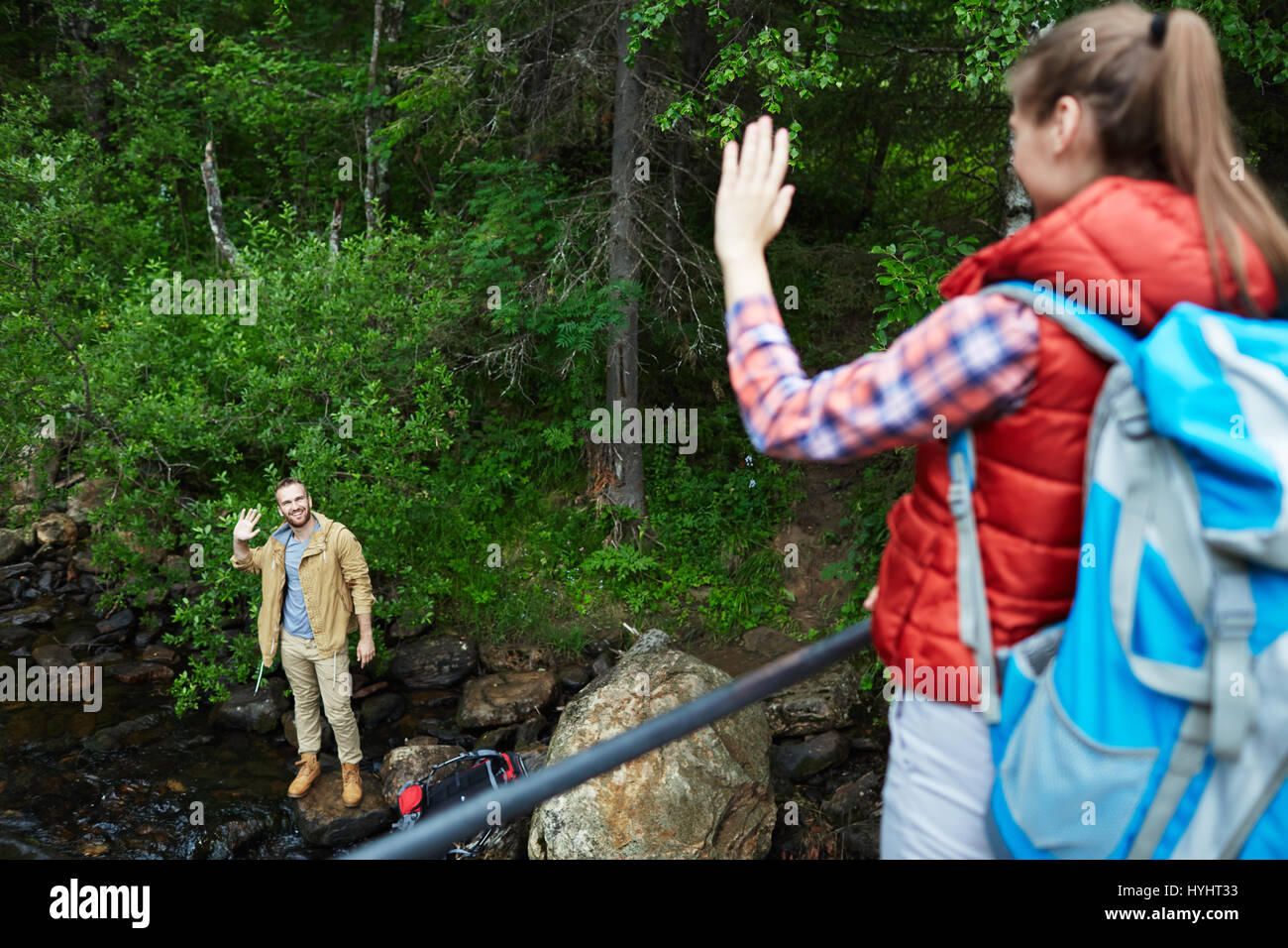 Tourists waving hands Stock Photo - Alamy