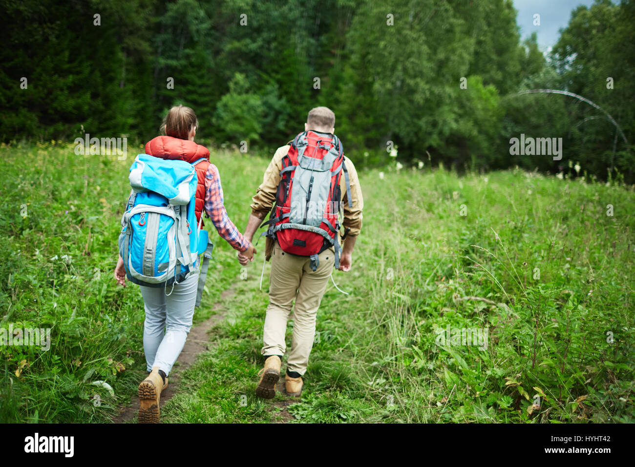Walk of backpackers Stock Photo - Alamy