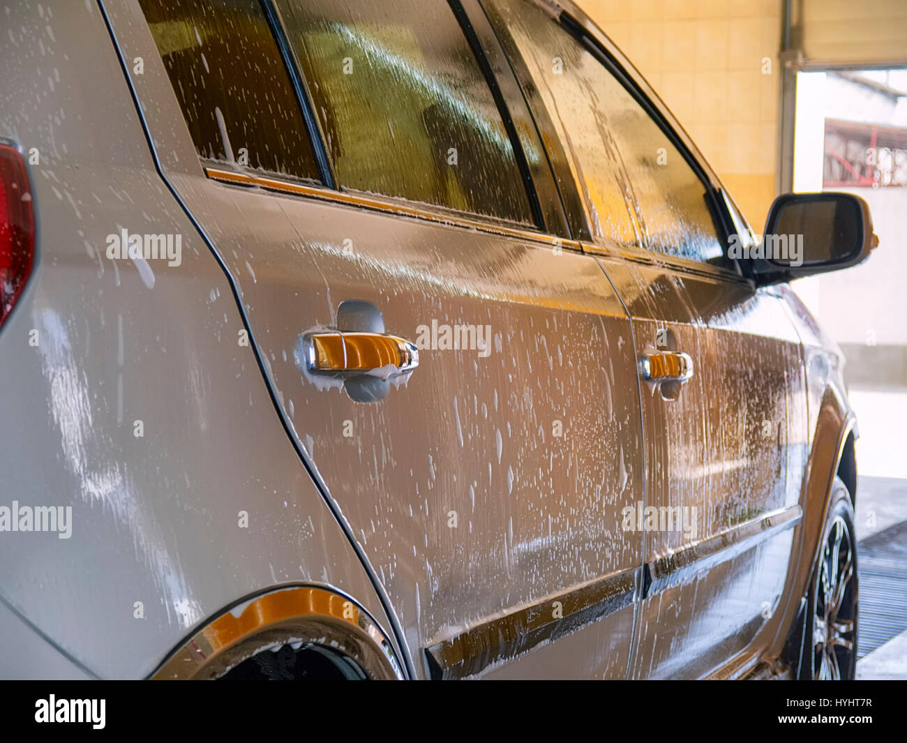 The wet clean car on car wash Stock Photo - Alamy