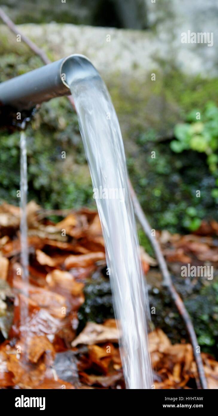 Mountain Spring Coming from a Pipe Stock Photo - Alamy