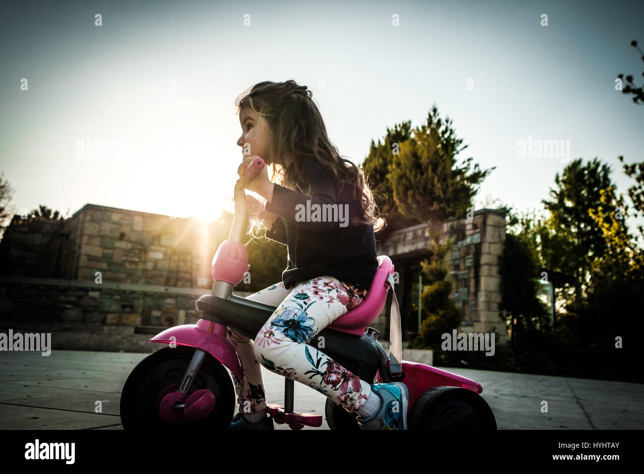 kid girl bike sunset Stock Photo - Alamy