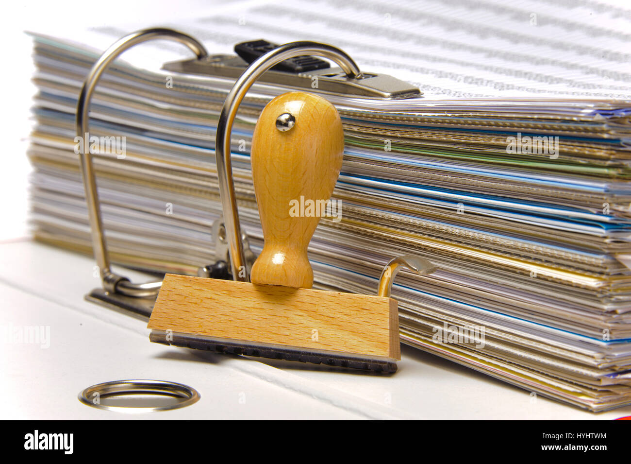 ring binder with documents and blank rubber stamp ready for your text ...