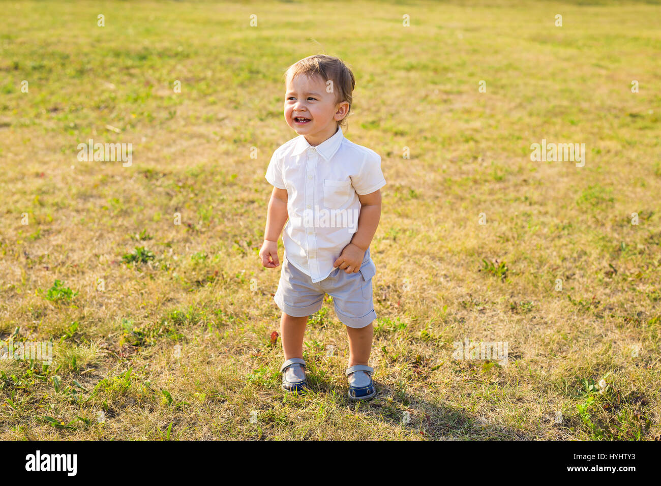 little boy playing in summer nature Stock Photo - Alamy