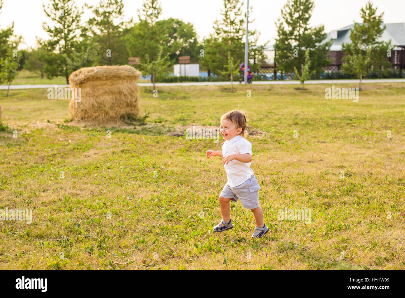 little boy playing in summer nature Stock Photo - Alamy